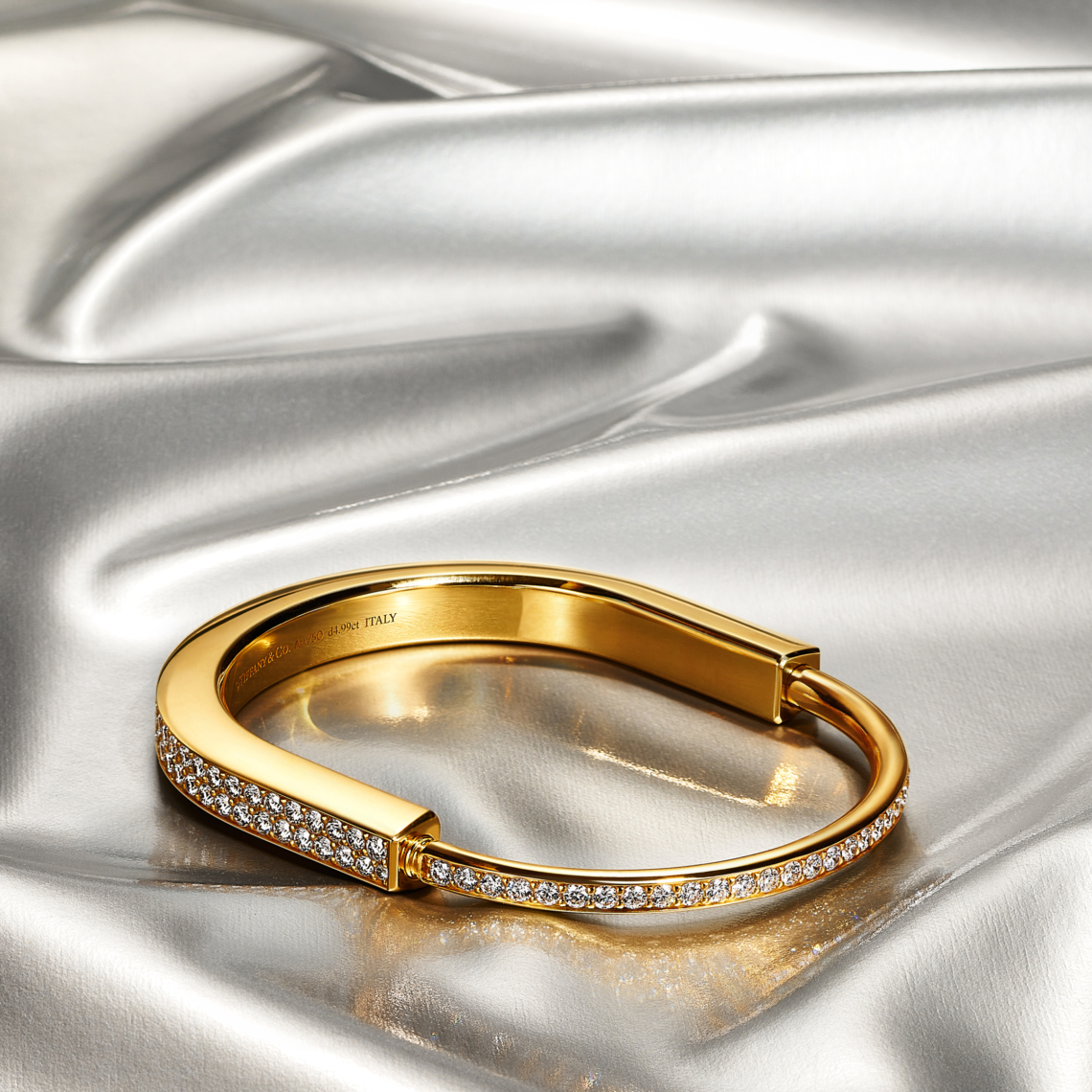 Tiffany Lock bangle in 18k yellow gold with diamonds. - Tiffany