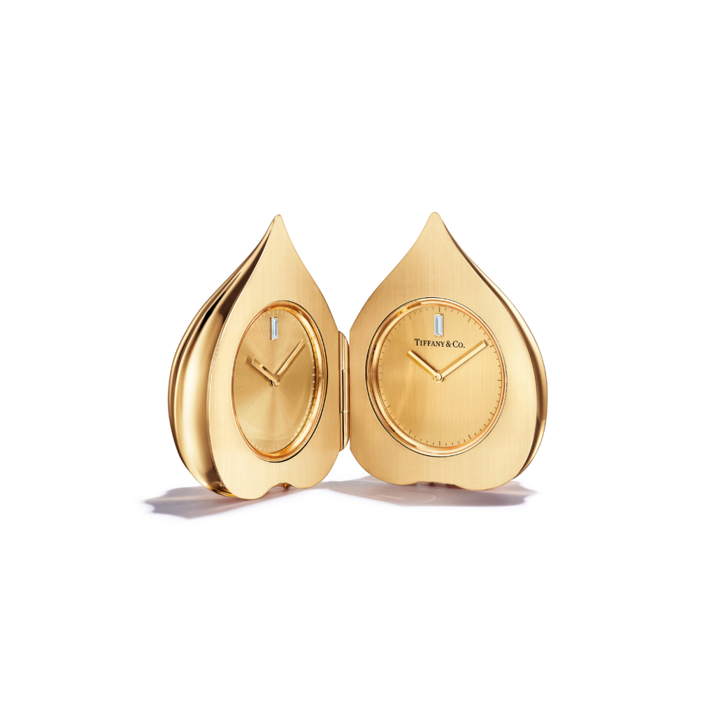 Dual time clock in 18k yellow gold with diamonds. Quartz movement ...