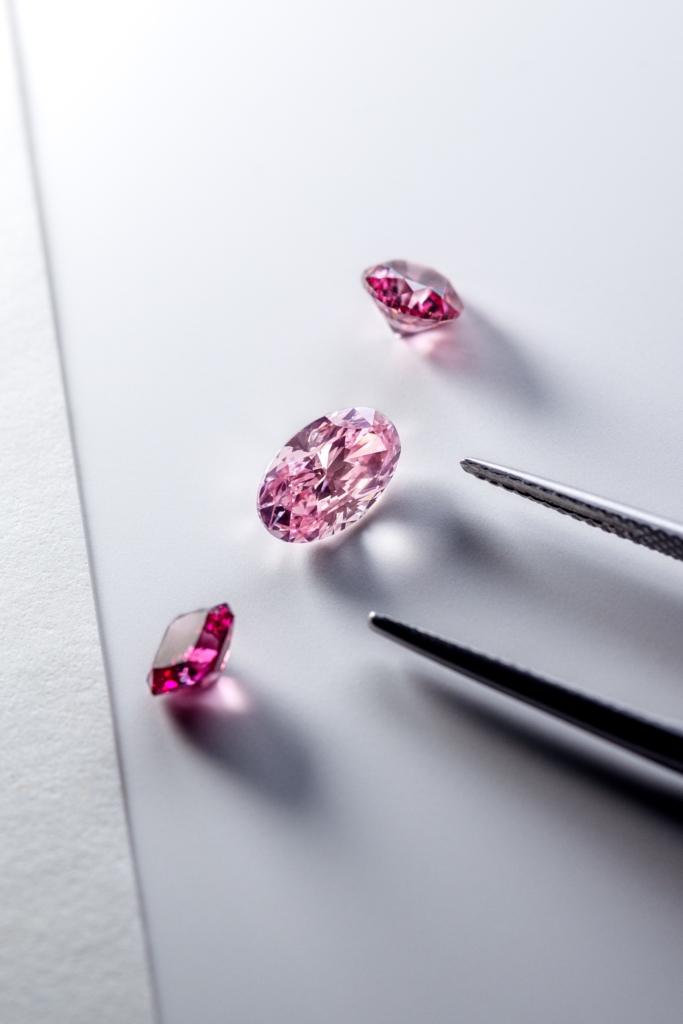 A Fancy Red diamond, a Fancy Intense Purplish Pink diamond and a Fancy ...